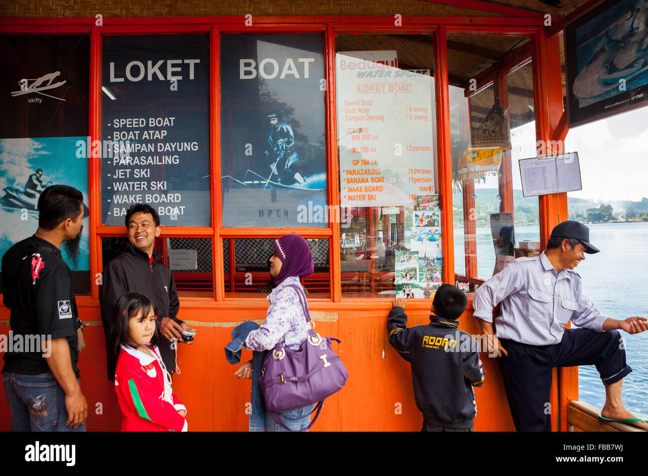 Crowd waiting at ticket box at lakeside tourist attraction Stock Photo ...