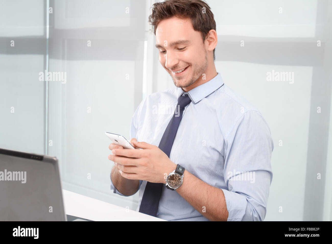 Call center operator holding mobile phone Stock Photo - Alamy