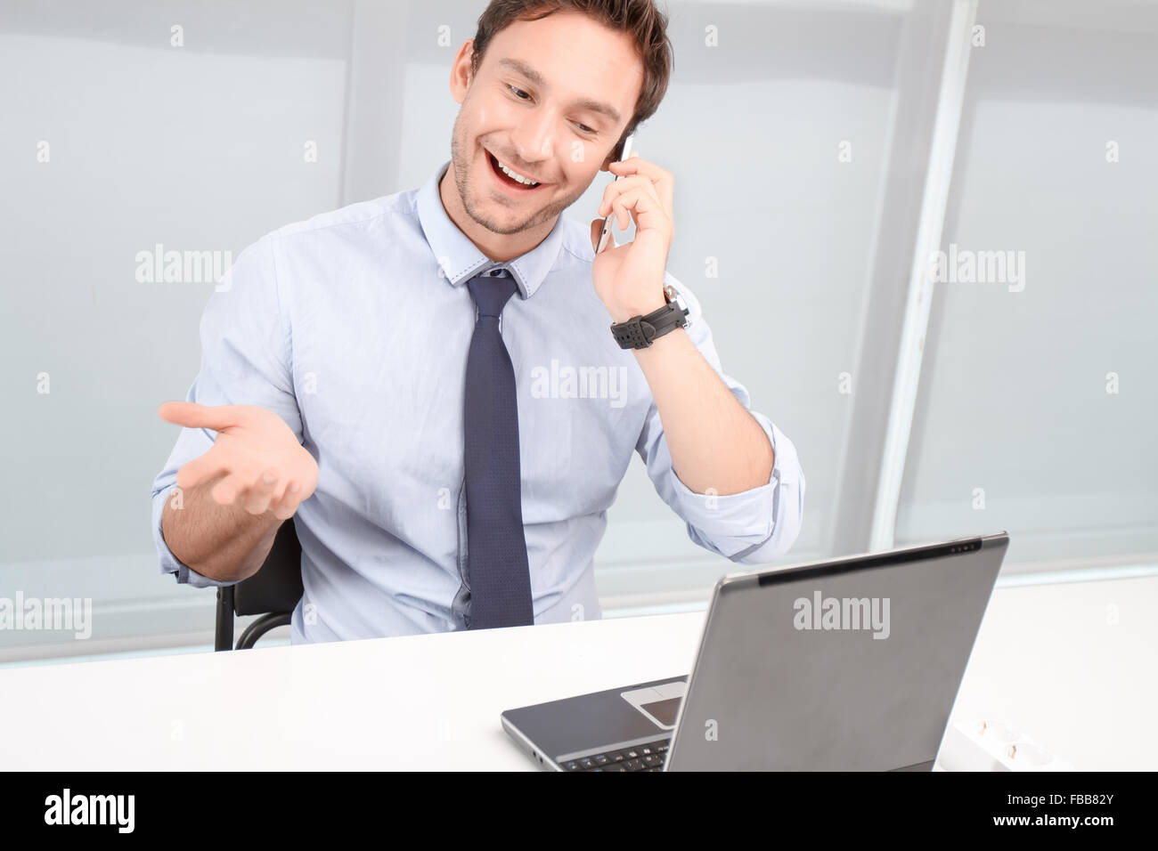 Call center operator holding mobile phone Stock Photo - Alamy