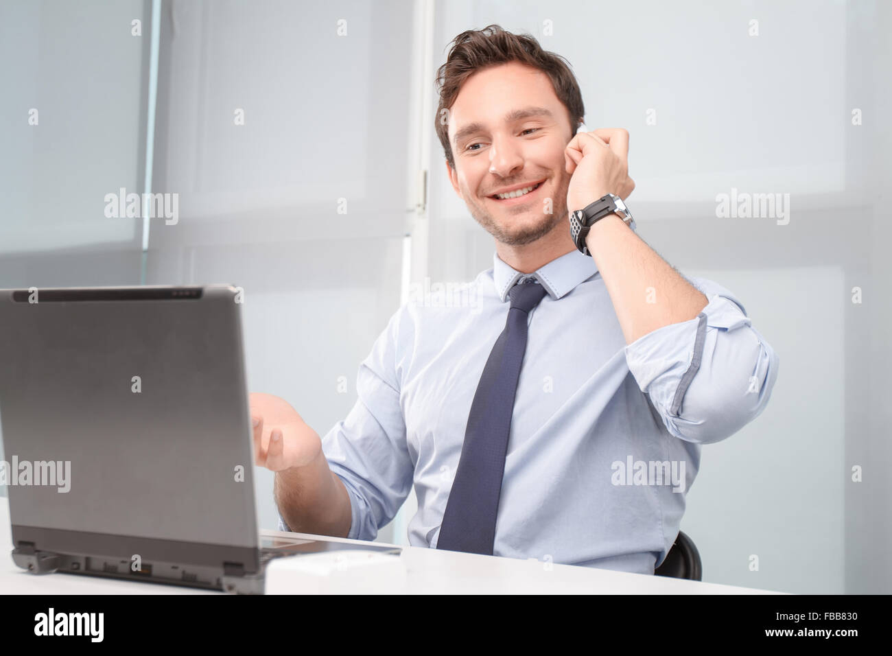 Call center operator holding mobile phone Stock Photo - Alamy