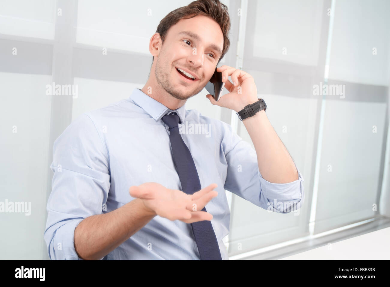 Call center operator talking on mobile phone Stock Photo - Alamy