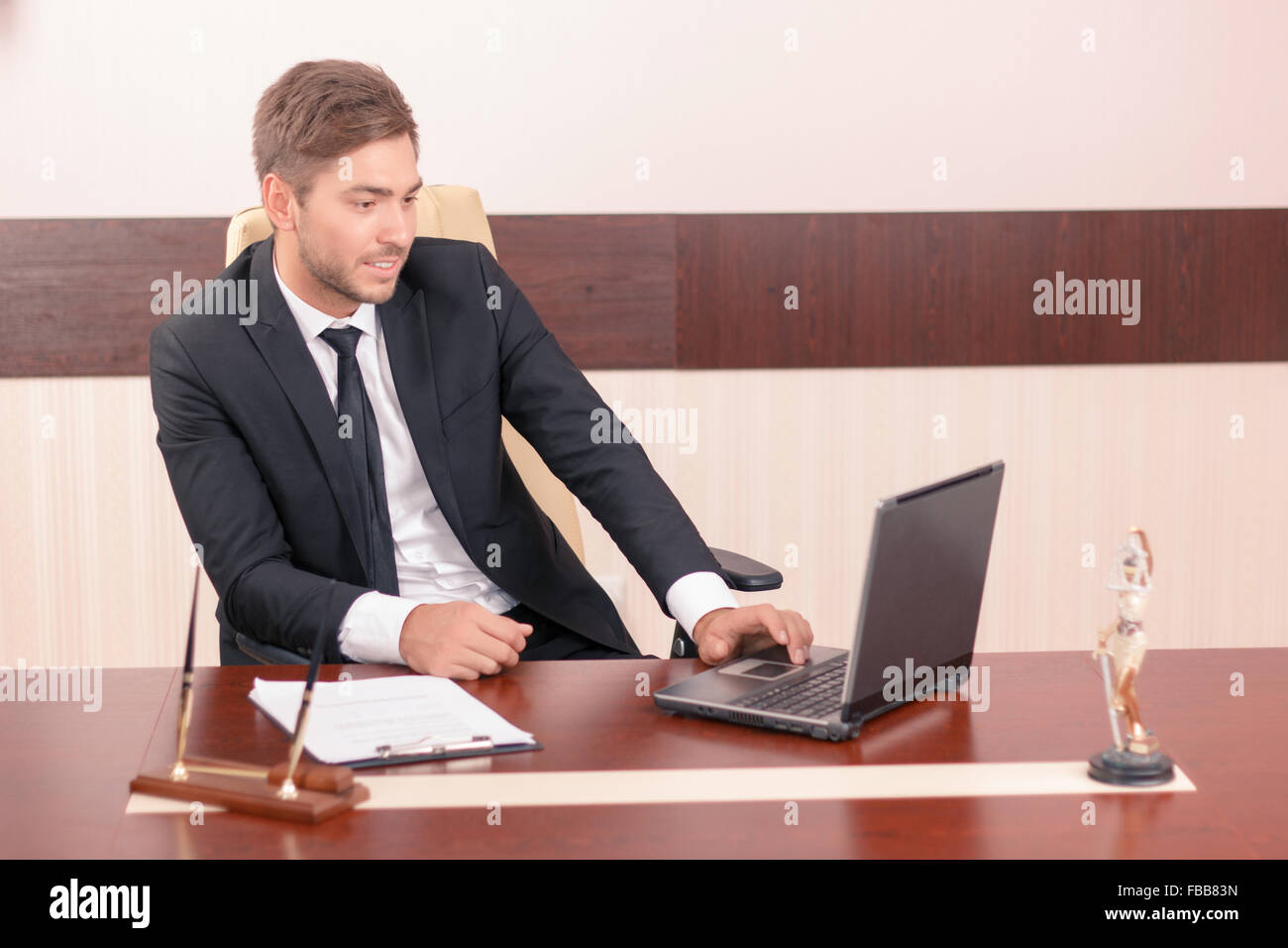 Handsome lawyer working on his laptop Stock Photo - Alamy