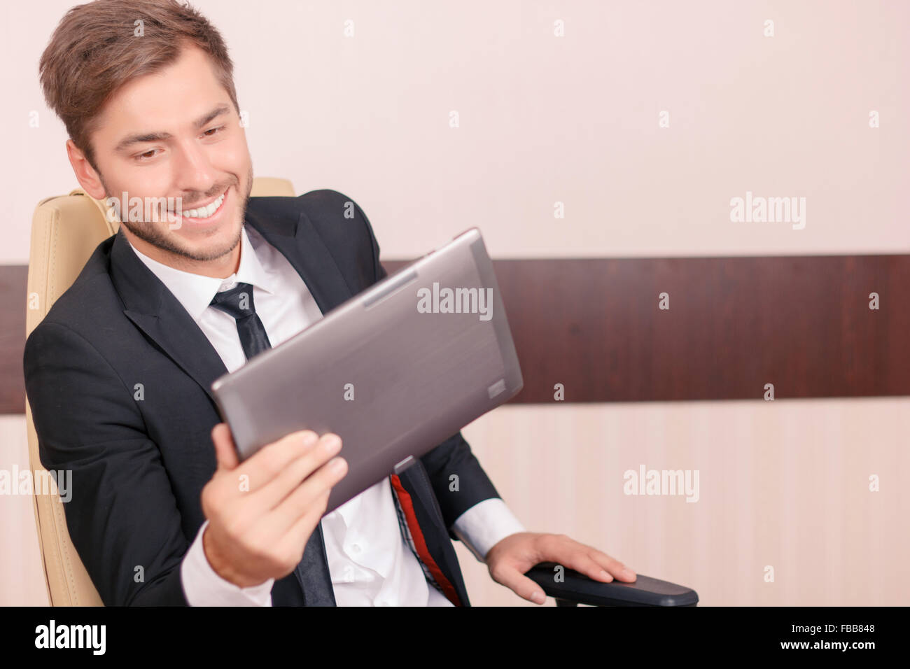 Pleasant lawyer holding laptop Stock Photo - Alamy
