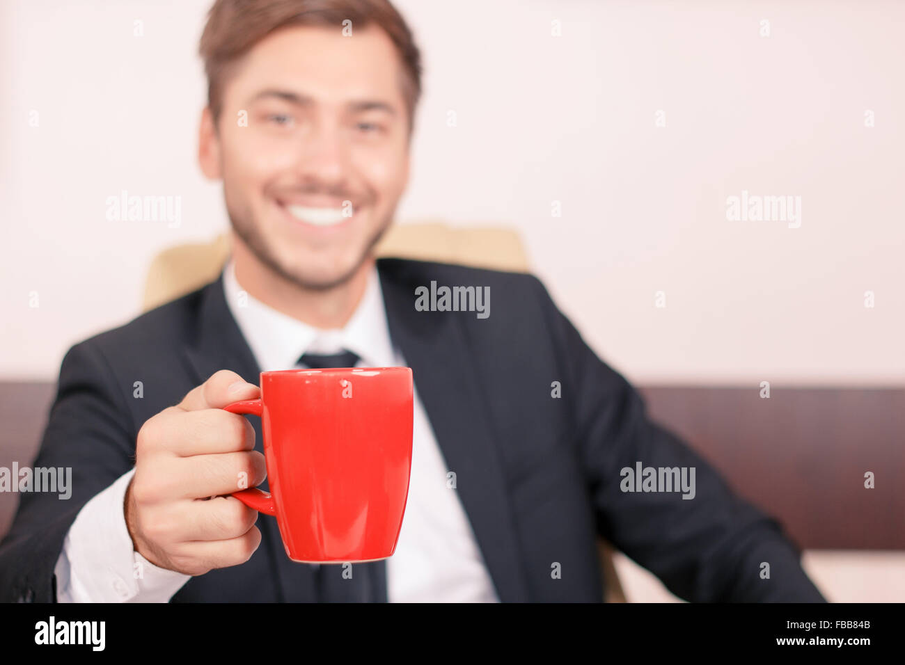 Smiling lawyer drinking tea Stock Photo - Alamy