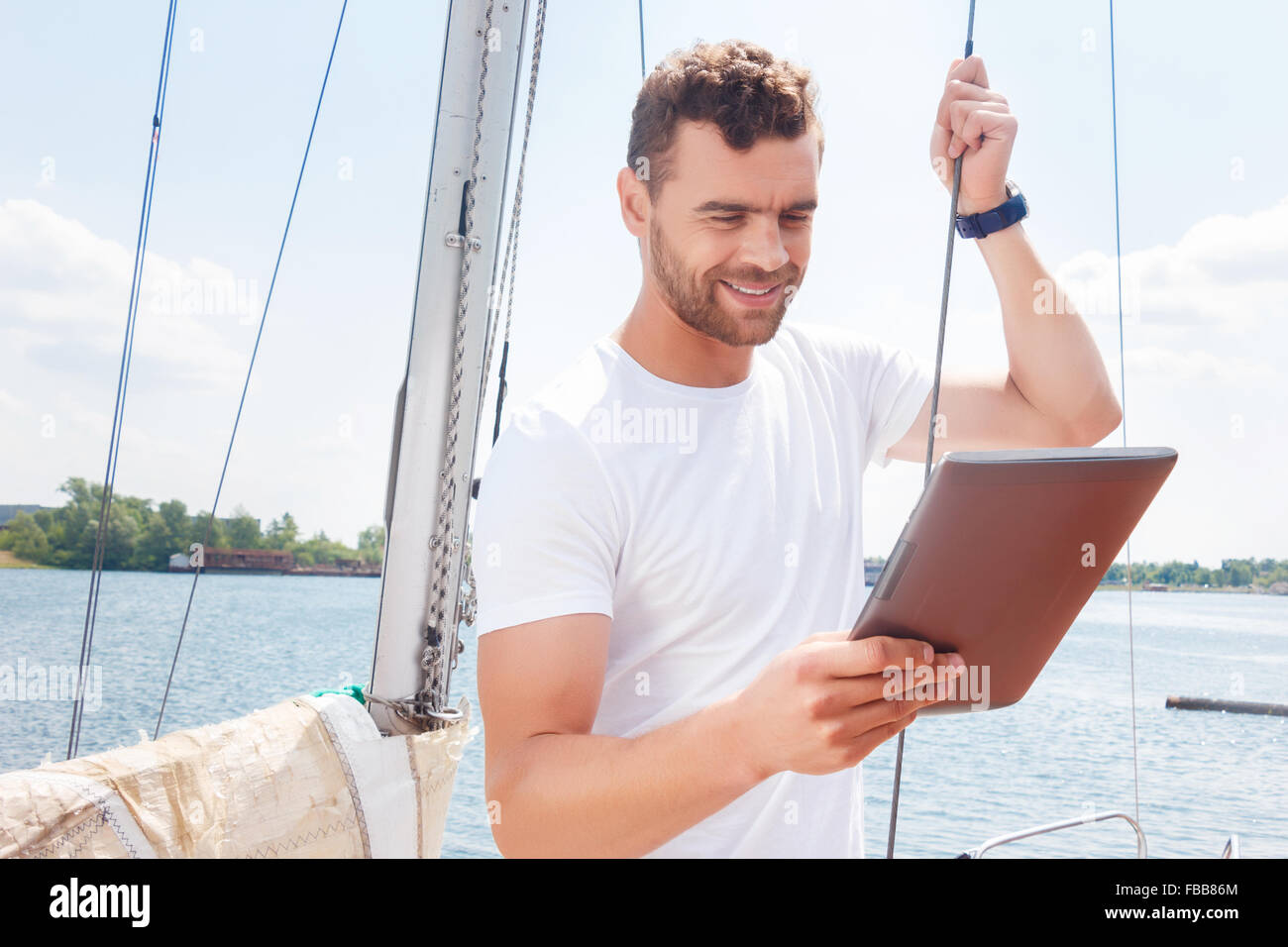 Cheerful guy holding model hi-res stock photography and images - Alamy