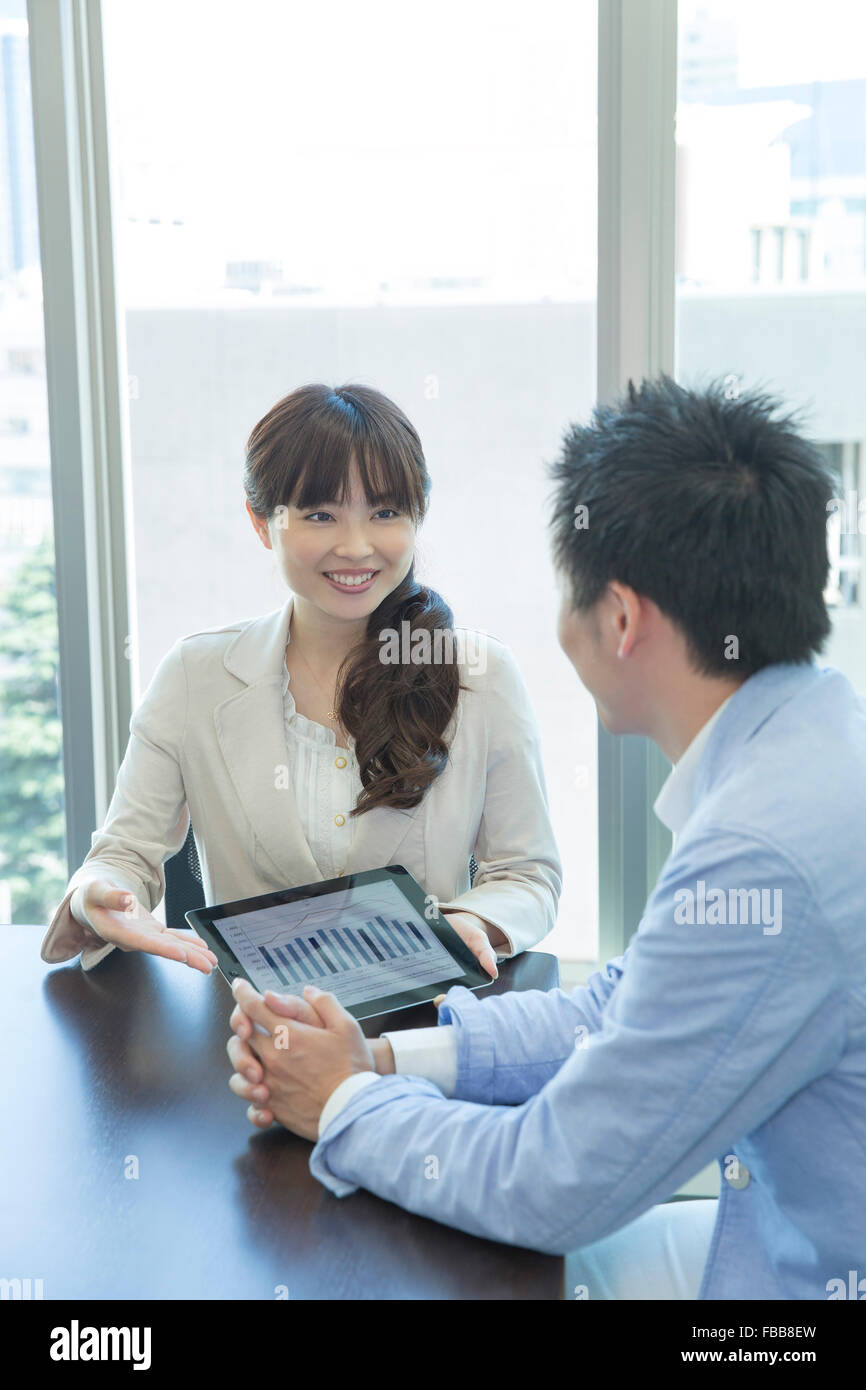 Two Business People in Meeting Stock Photo - Alamy