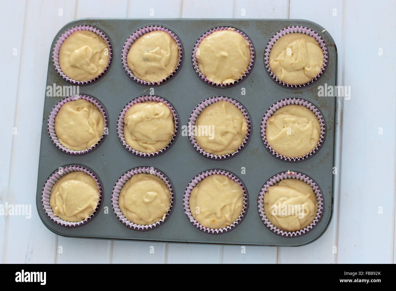 Uncooked cupcakes in cupcake tin Stock Photo - Alamy