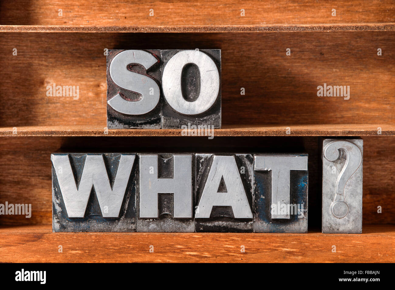 so what question made from metallic letterpress type on wooden tray ...