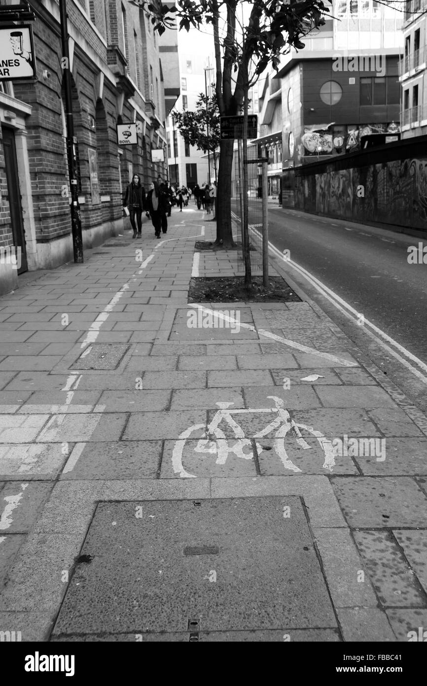 Cycle track painted on the streets of Bristol, going around trees ...