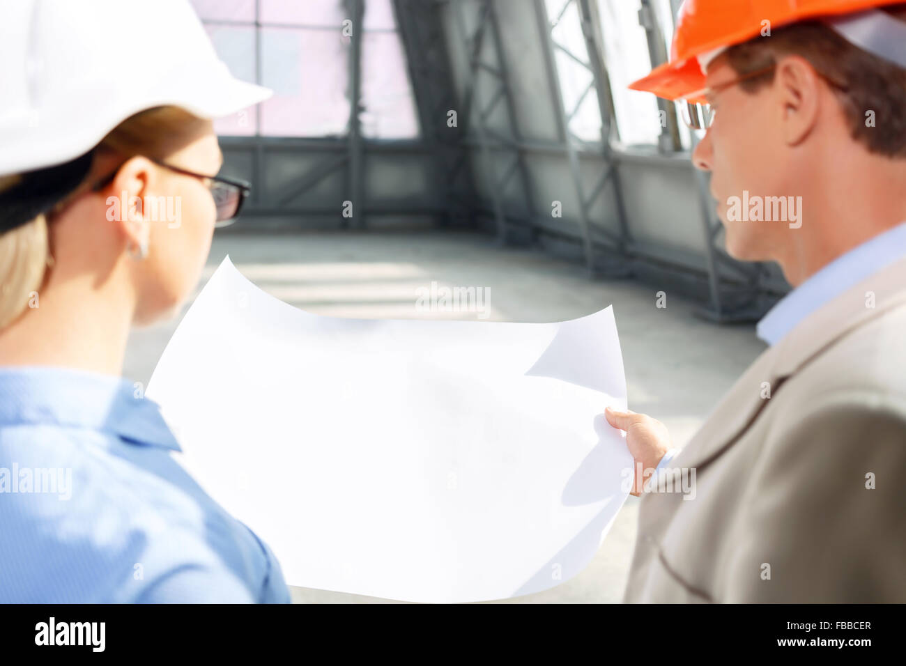 Professional architects discussing project Stock Photo - Alamy