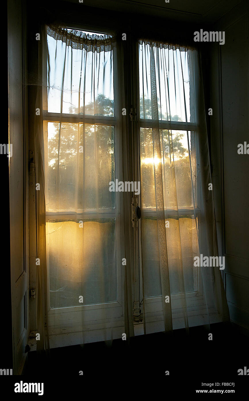 Sunset through a Window Stock Photo - Alamy