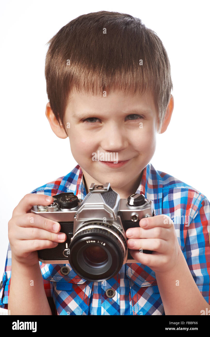 Little boy reporter photographer with SLR camera isolated close-up ...