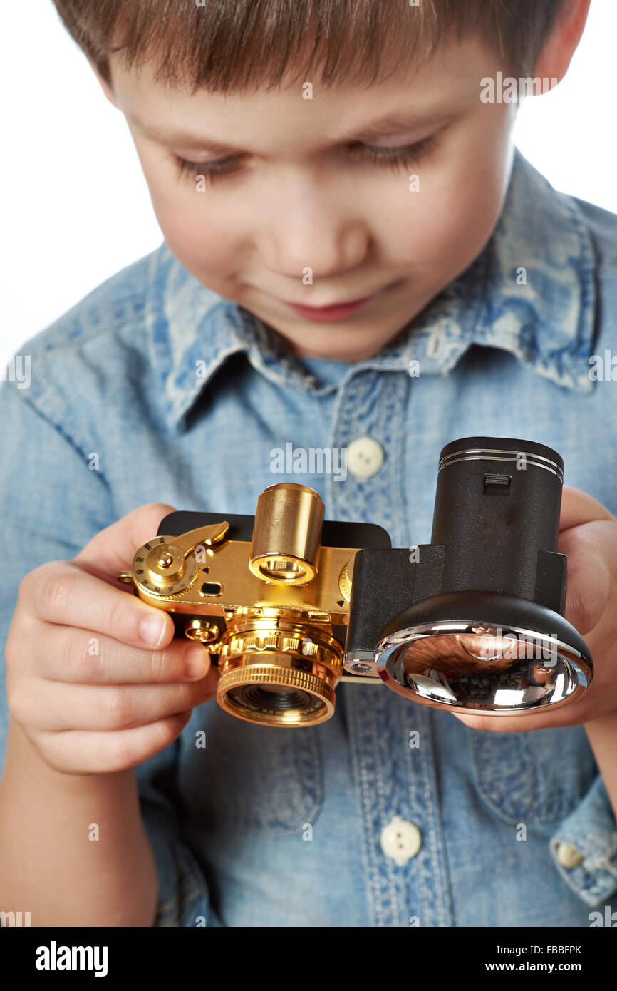 Little boy photographer with retro camera and flash Stock Photo - Alamy