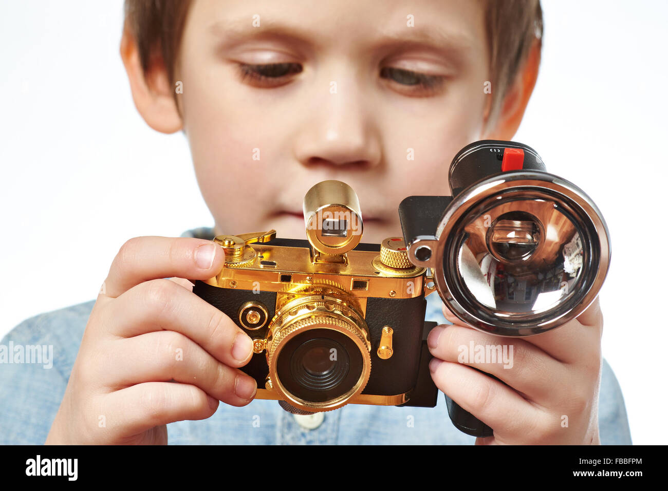 Little boy photographer with retro camera and flash Stock Photo - Alamy