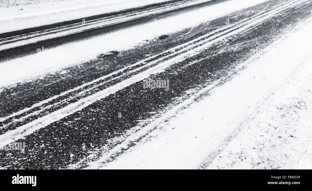 Winter slippery road background, black asphalt pavement under fresh ...