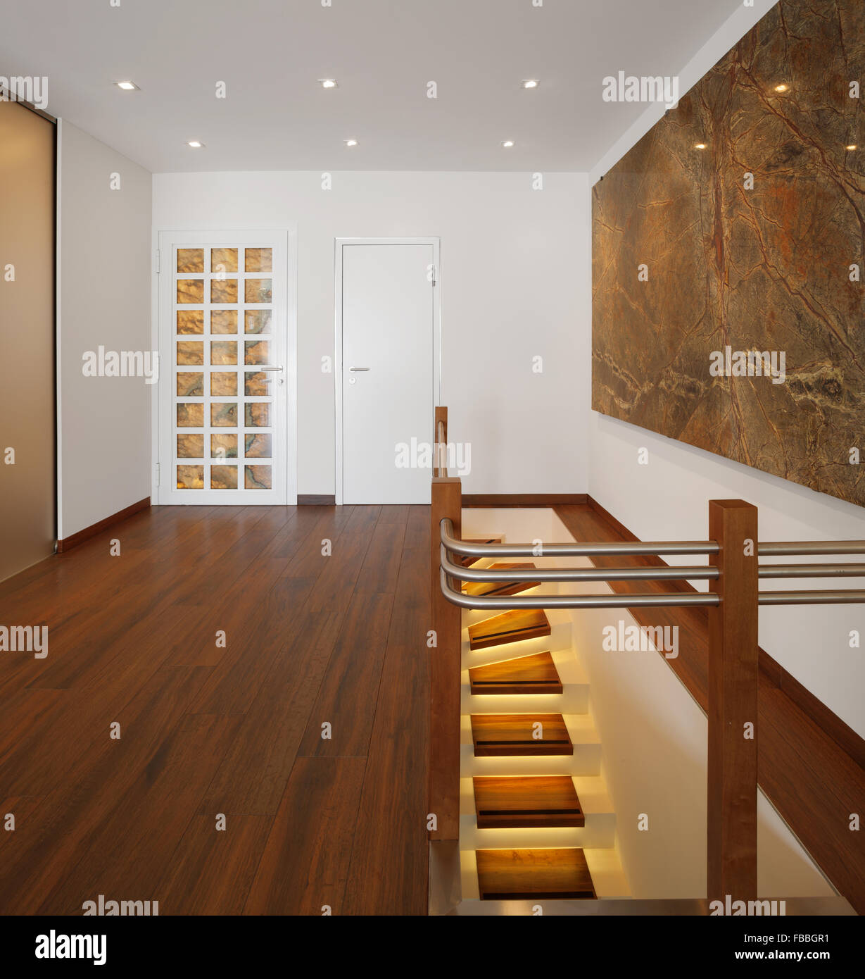 Modern house, entry with alight staircase Stock Photo - Alamy