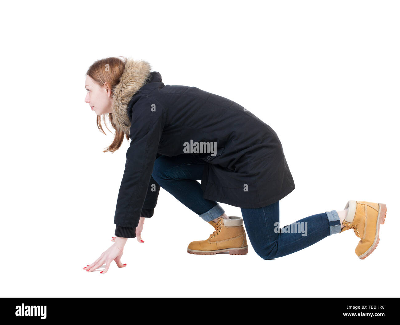 side view woman in start position. Standing young girl in parka. Rear ...