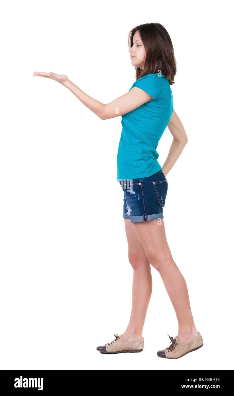 Back view of Beautiful woman holds hand up. Rear view people collection ...