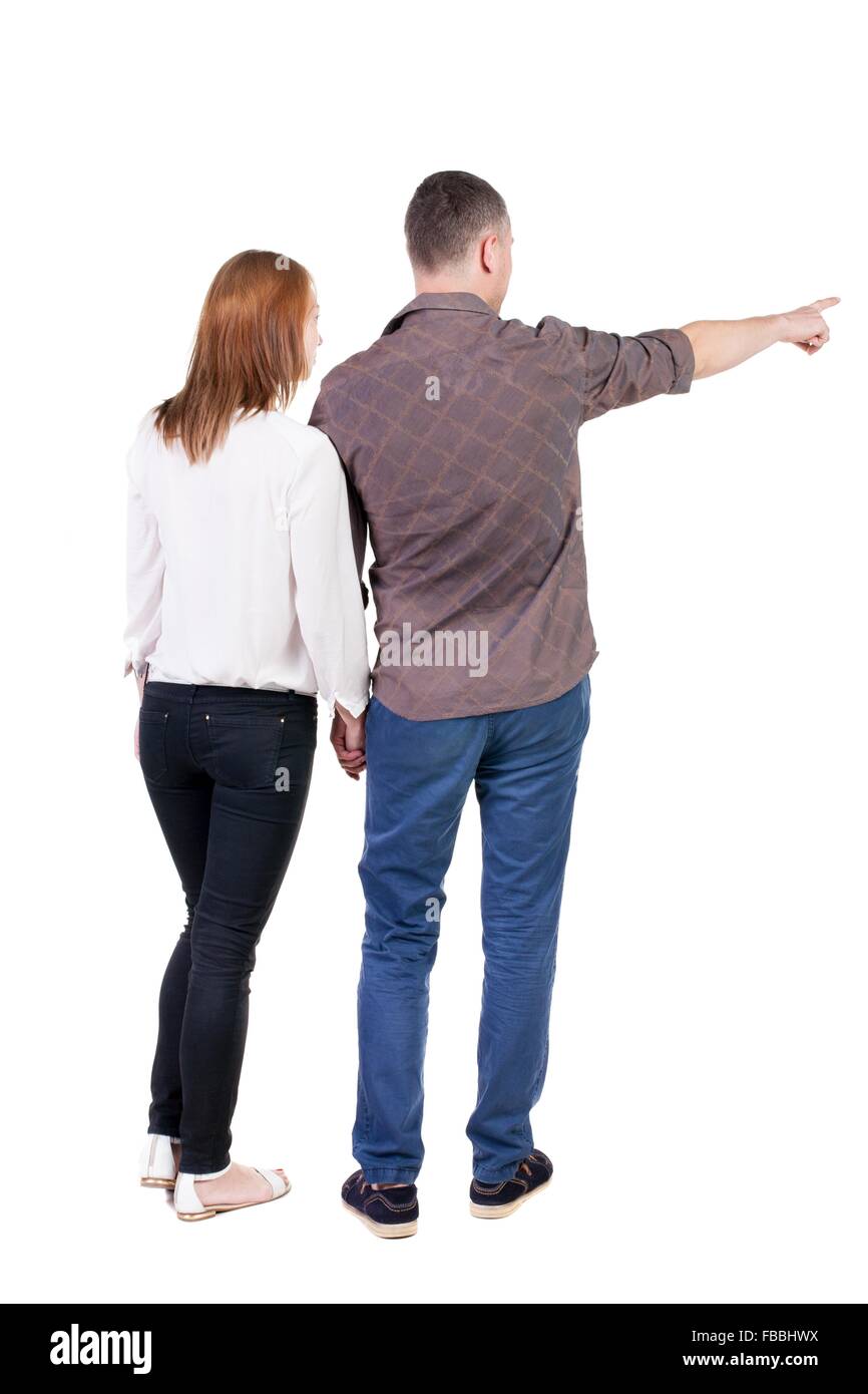 young couple pointing. Back view. Rear view people collection. backside ...