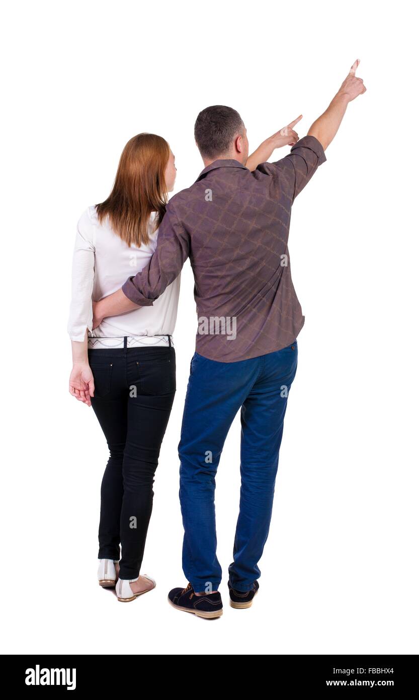 young couple pointing. Back view. Rear view people collection. backside ...