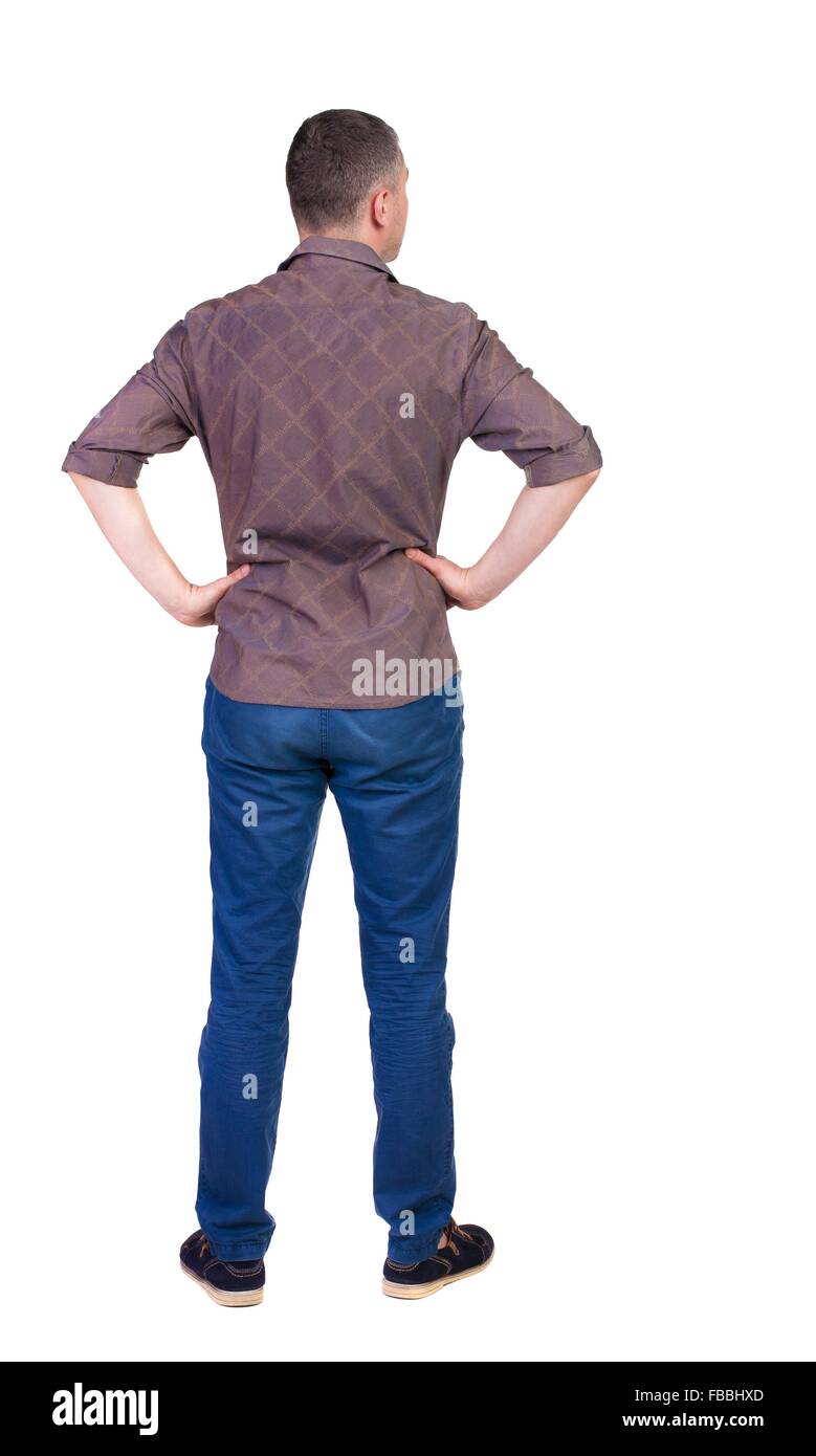Back view of handsome man in shirt looking up. Standing young guy in ...
