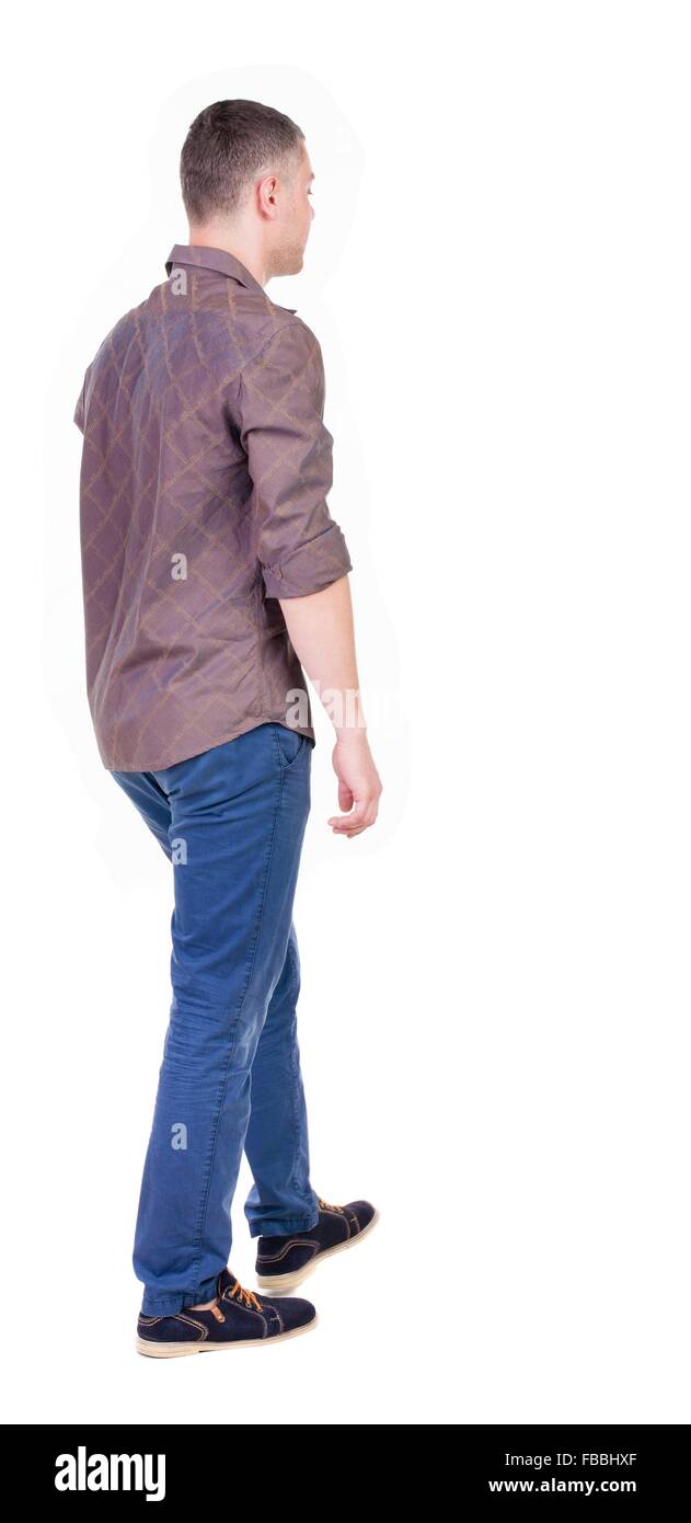 Back view of going handsome man in jeans and a shirt. walking young guy ...