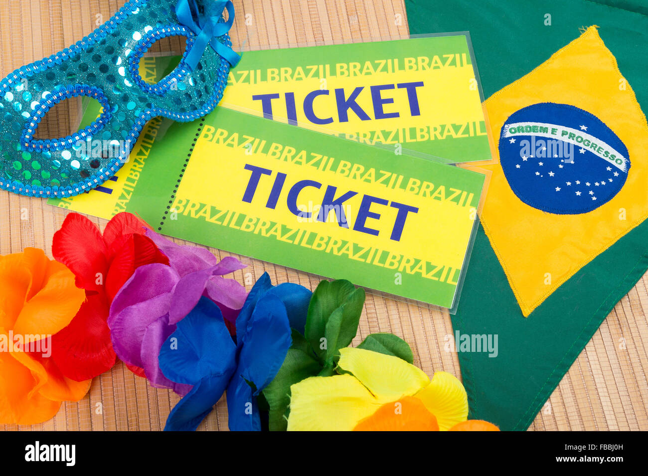 Brazil tickets sit on tropical wood background with sparkly carnival ...
