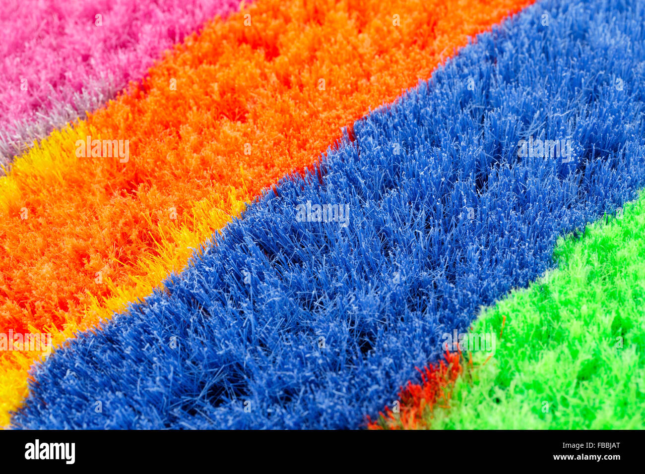 Colorful brooms closeup picture Stock Photo - Alamy
