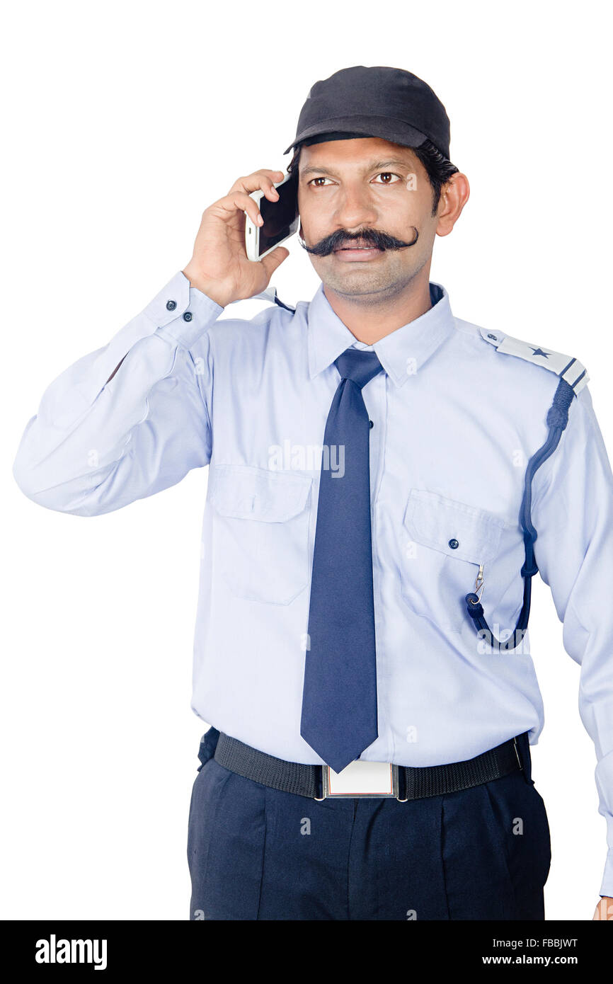 1 indian man Security Guard talking Mobile Phone Stock Photo - Alamy