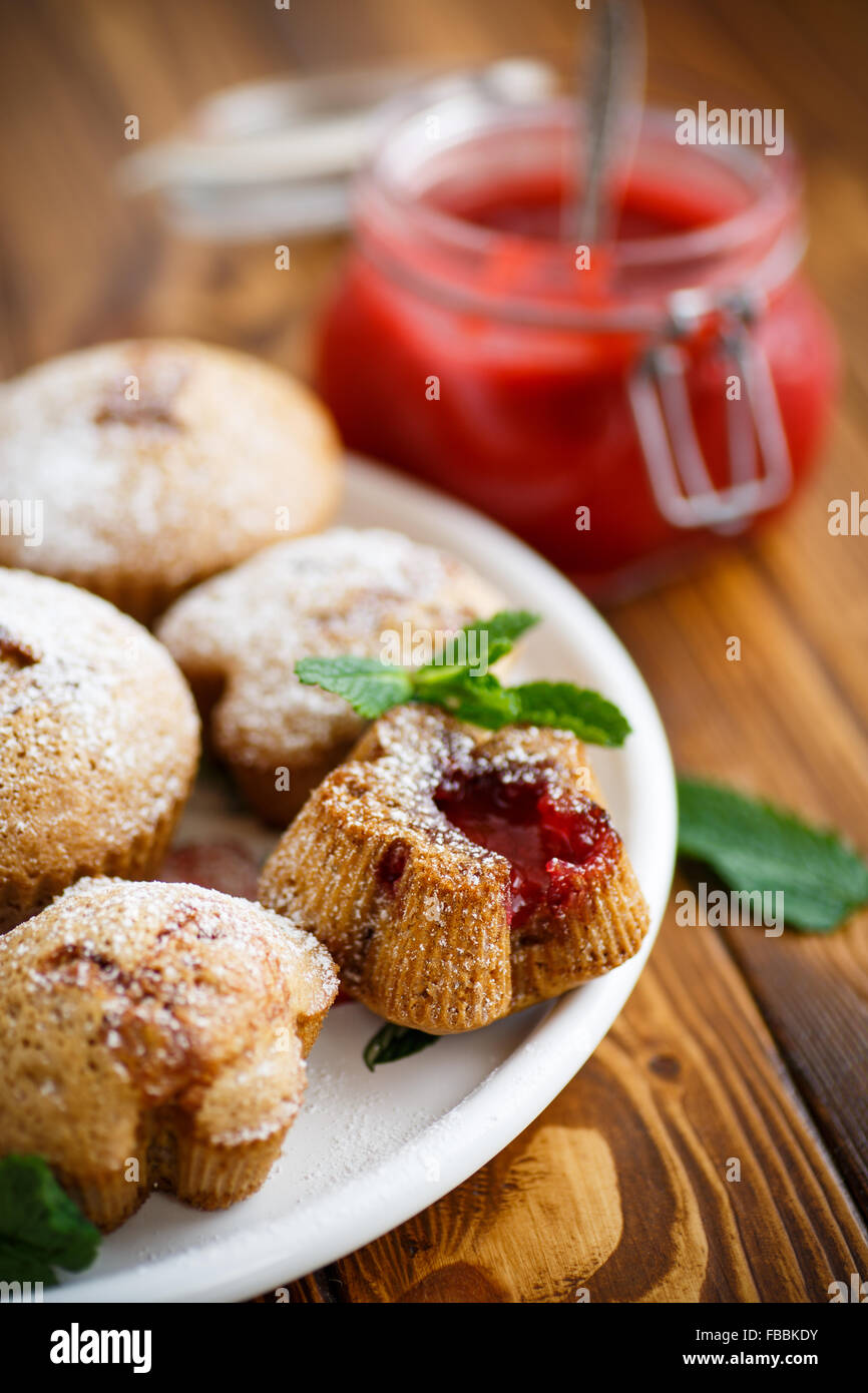 sweet muffins with fruit jam inside Stock Photo - Alamy