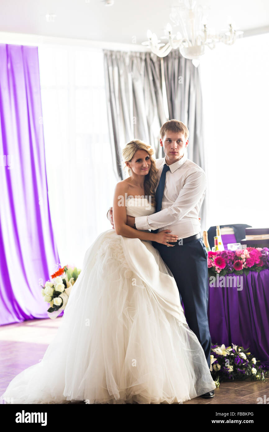 Happy bride and groom on their wedding reception Stock Photo - Alamy