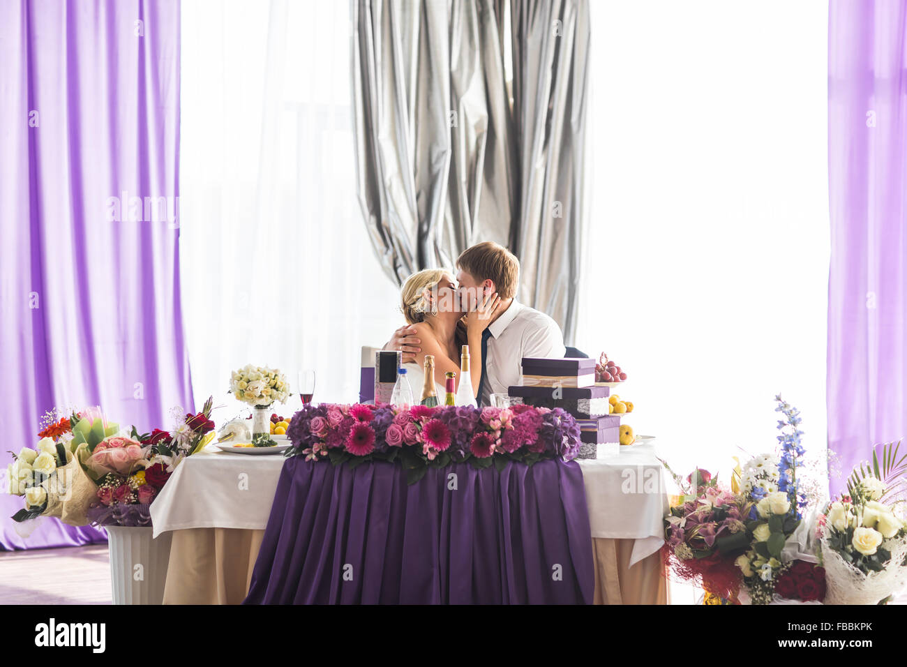 Happy bride and groom on their wedding reception Stock Photo - Alamy