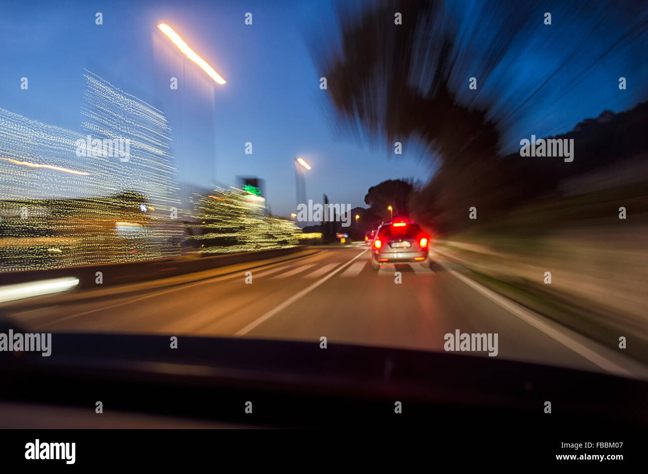 Night view of a car on city street Stock Photo - Alamy