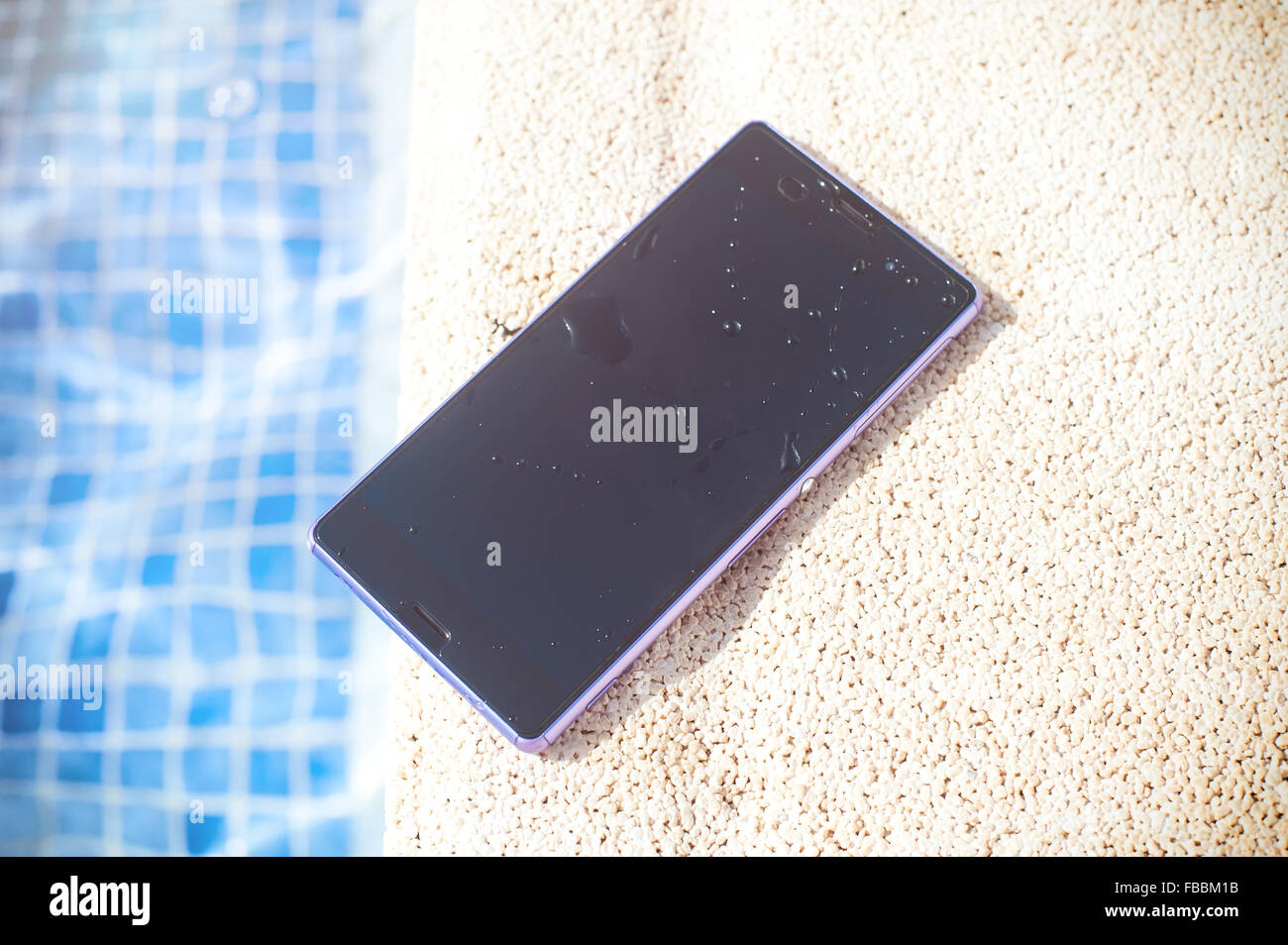 Smartphone around the pool Stock Photo - Alamy