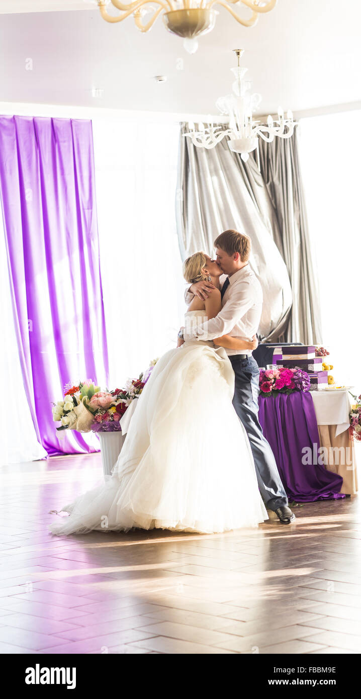Happy bride and groom on their wedding reception Stock Photo - Alamy