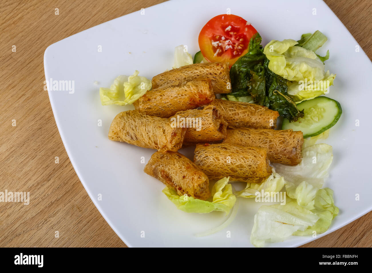 Asian traditional spring rolls on the wood background Stock Photo - Alamy