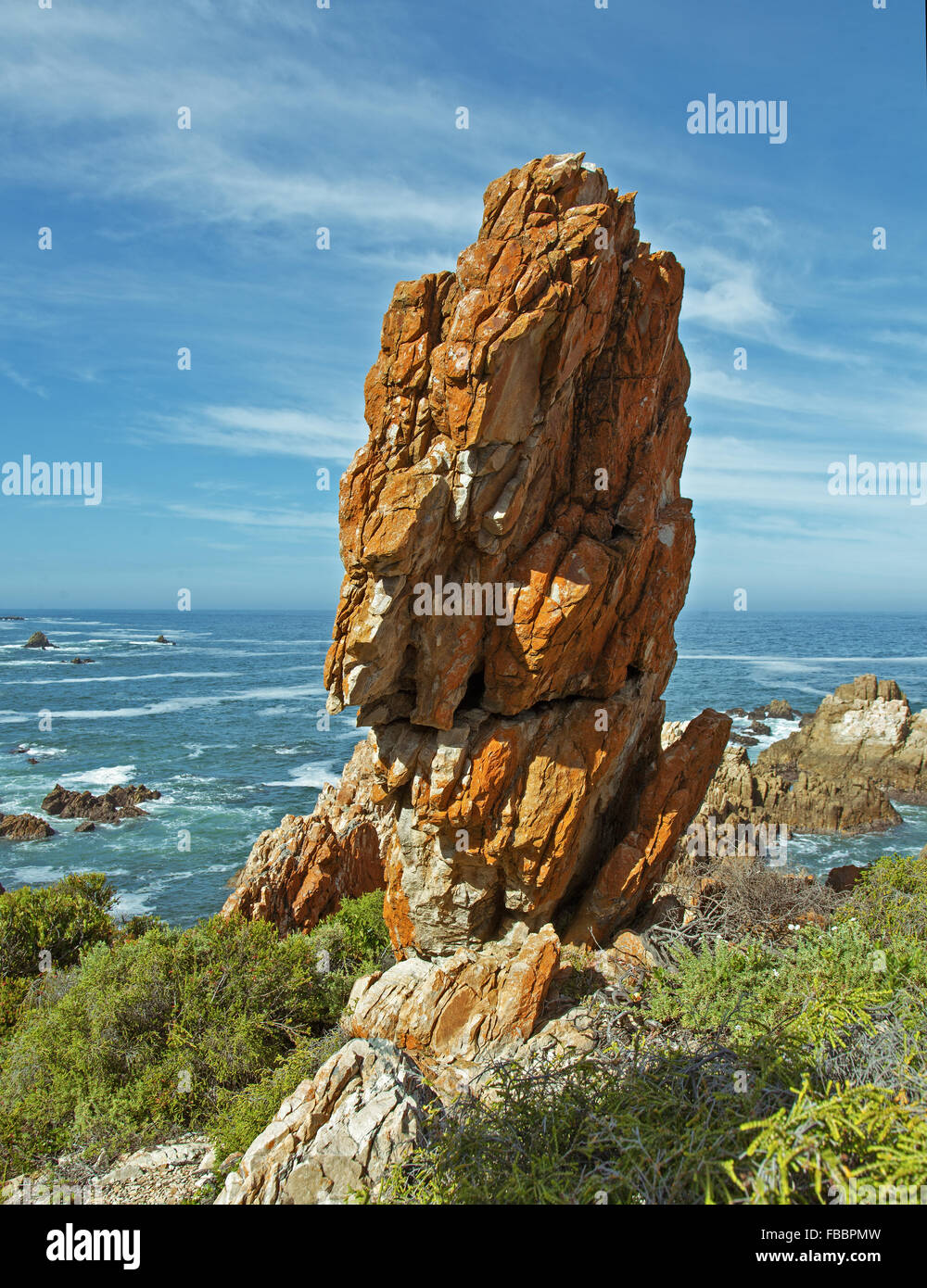 Huge red stone lying on the beach Stock Photo - Alamy