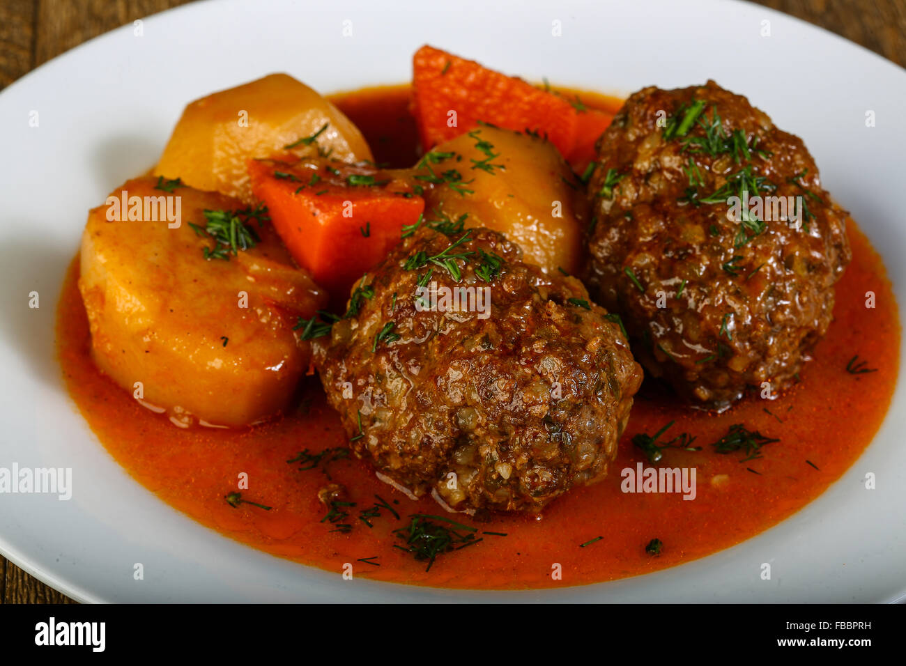Minced meat balls with potato, carrots and sauce Stock Photo - Alamy