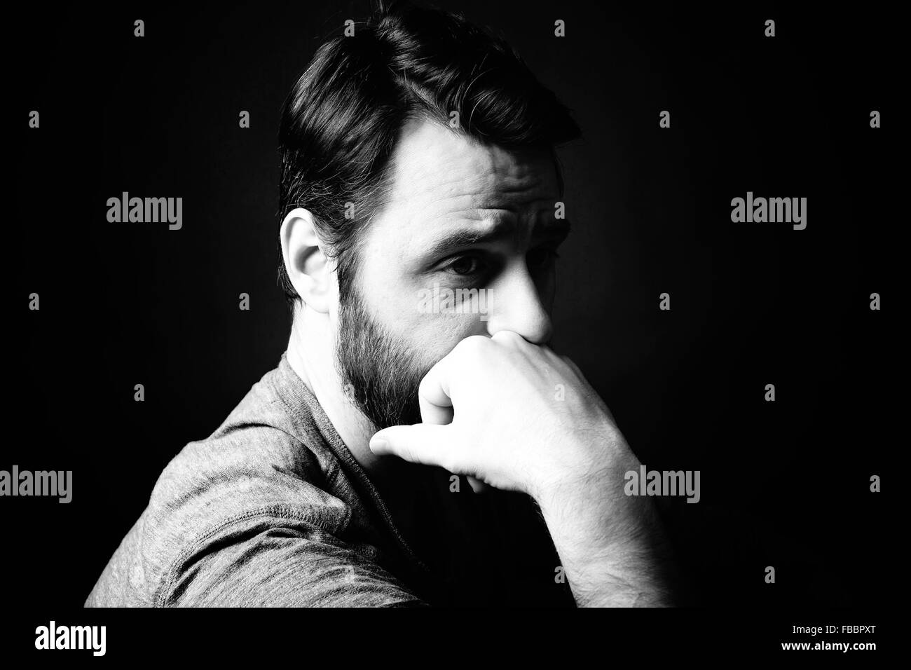 Sad man sitting head in Black and White Stock Photos & Images - Alamy