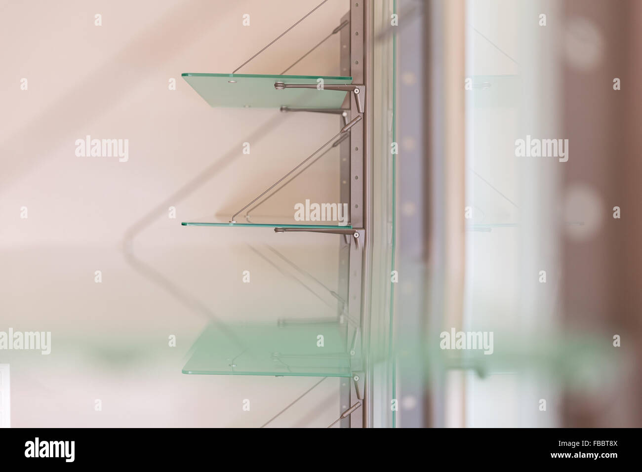 Detail of glass shelves empty Stock Photo - Alamy