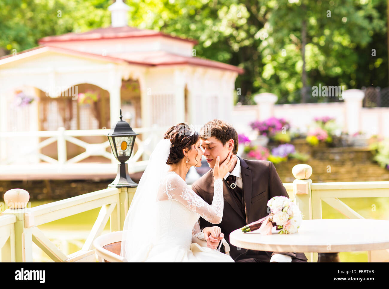 Bride and groom having a romantic moment on their wedding day Stock ...