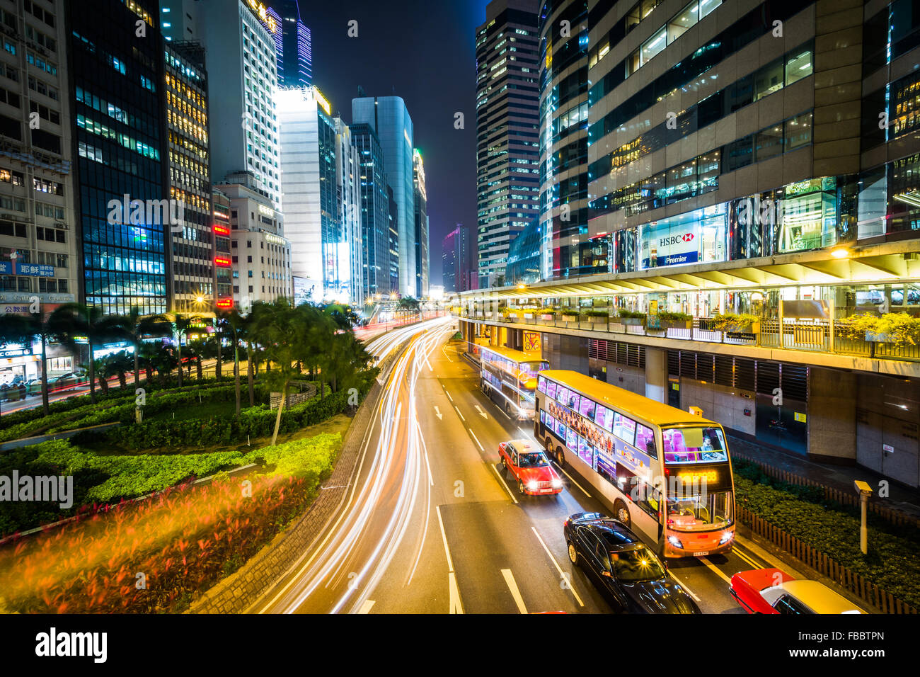 View of an intersection and skyscrapers at night, at Central, in Hong ...