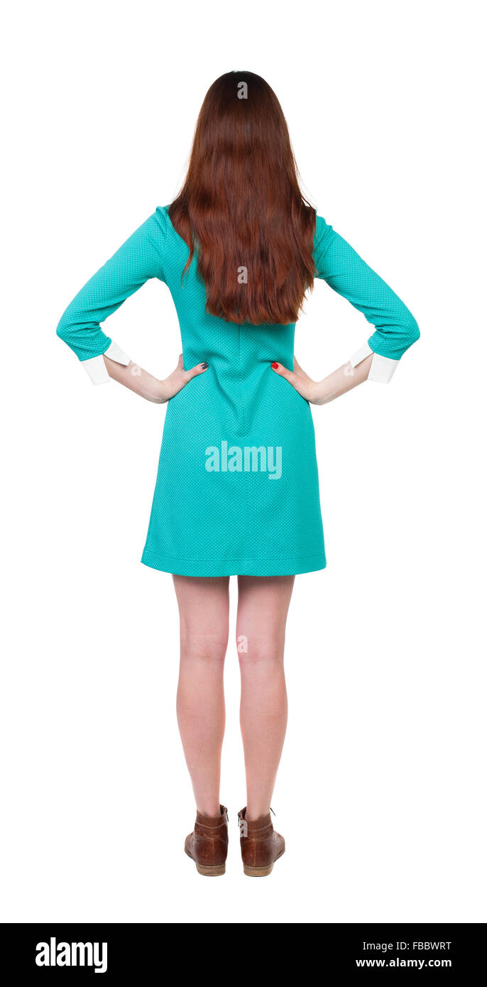 back view of standing young beautiful woman. girl watching. Rear view ...