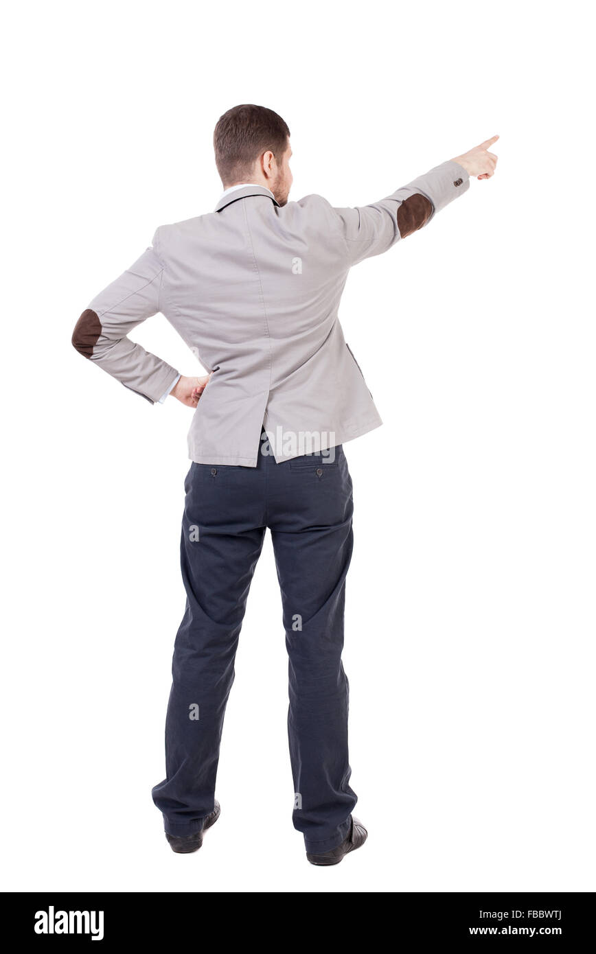 Back view of pointing business man. gesticulating young guy in black ...