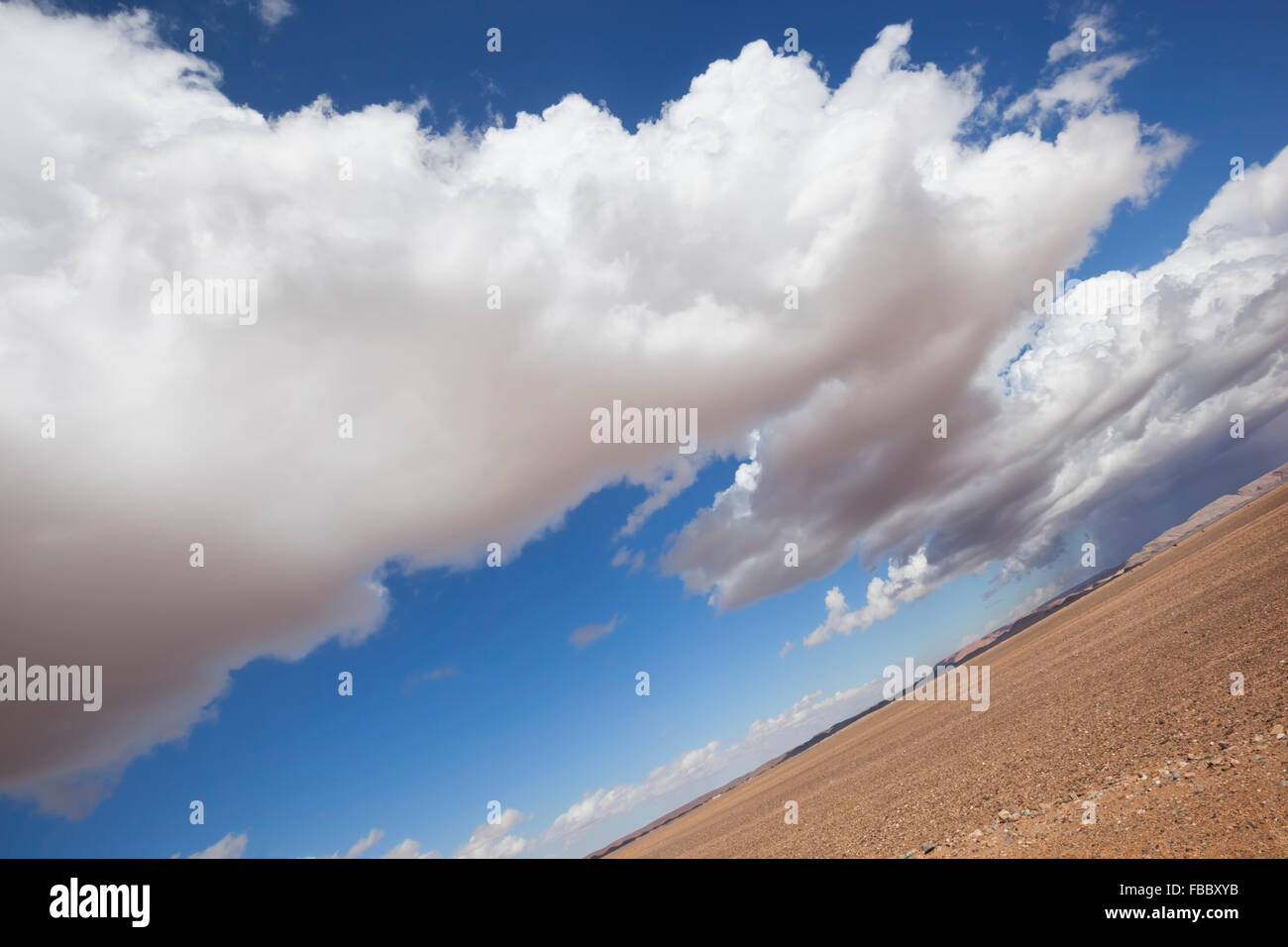 Blue desert sky with clouds hi-res stock photography and images - Alamy