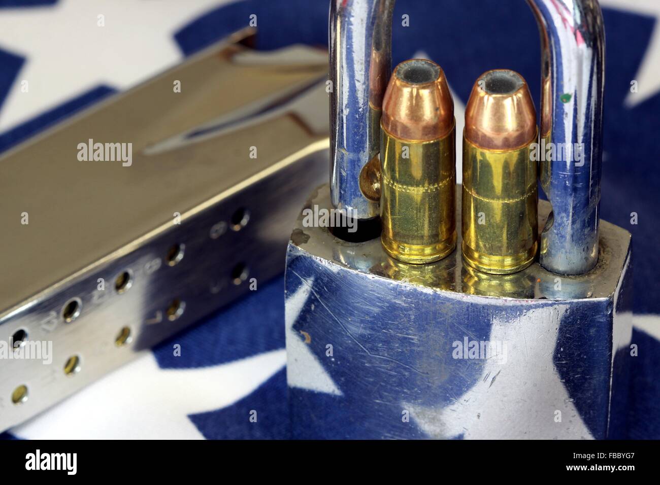 Ammunition and padlock on United States flag - Gun rights and gun ...