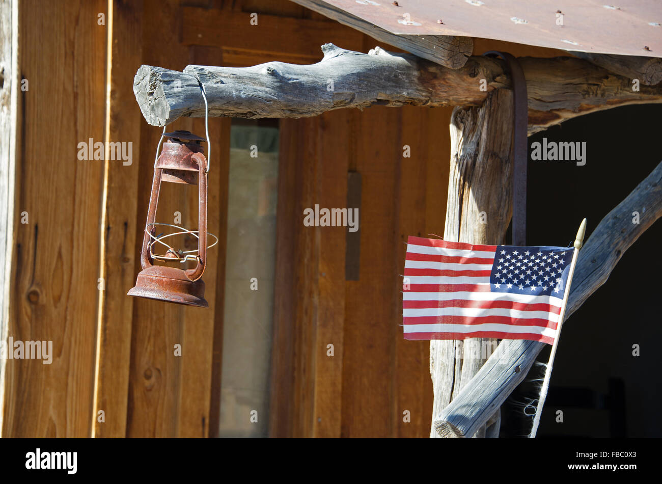 Lantern and US flag on a porch Stock Photo - Alamy
