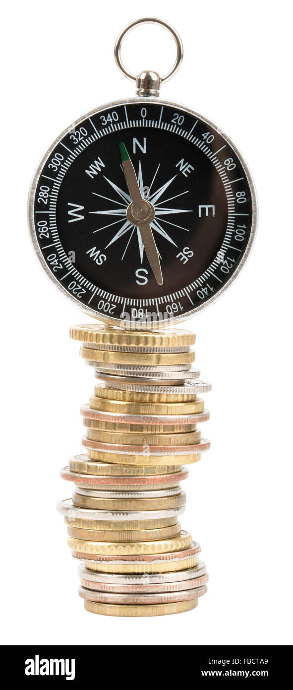Compass on stack of coins Stock Photo - Alamy