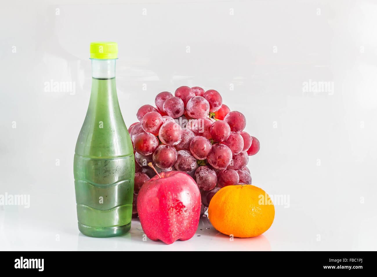 Juice and fruit on a white background Stock Photo - Alamy