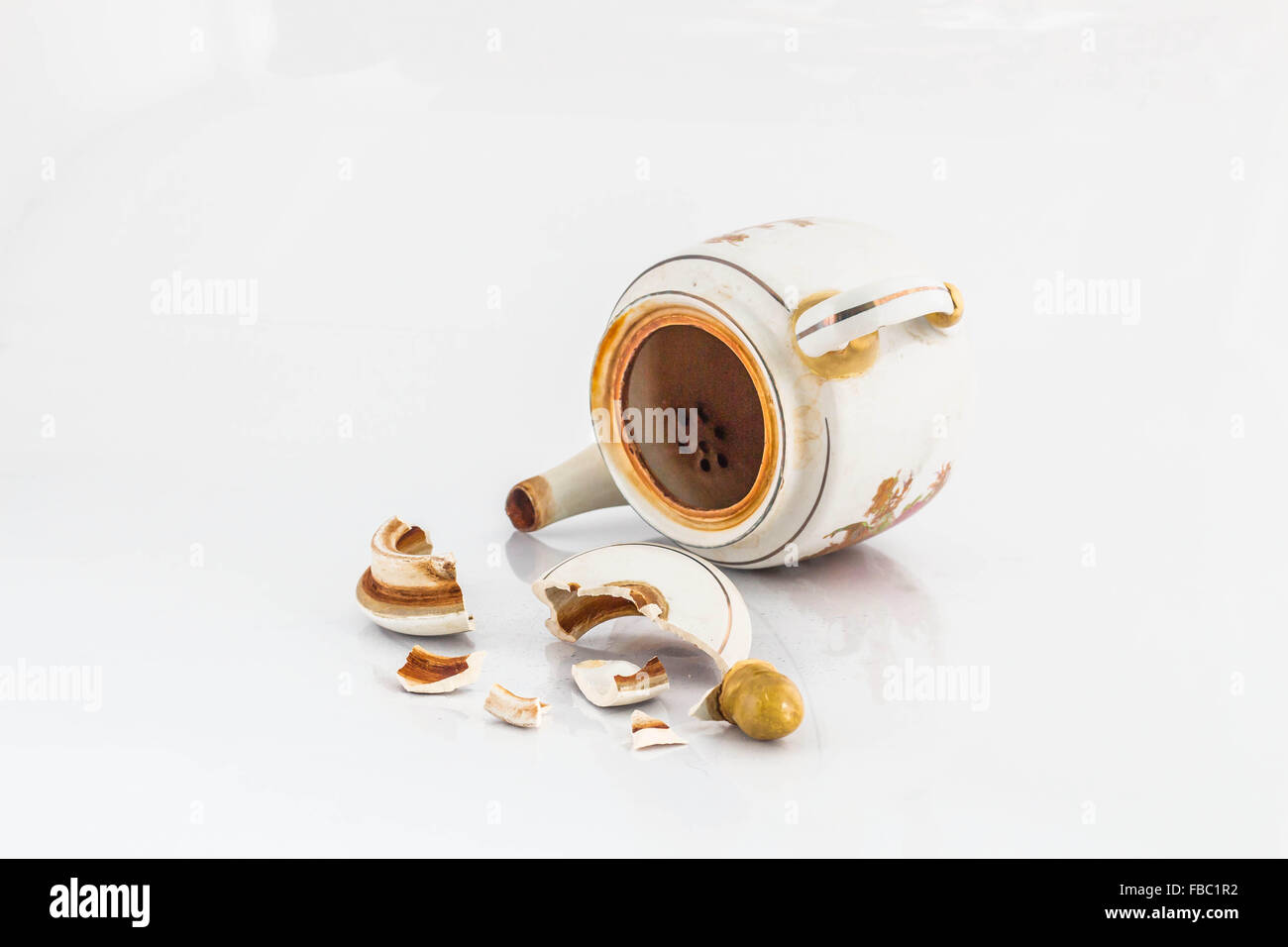 The fall shattered remnants teapot on a white background Stock Photo ...